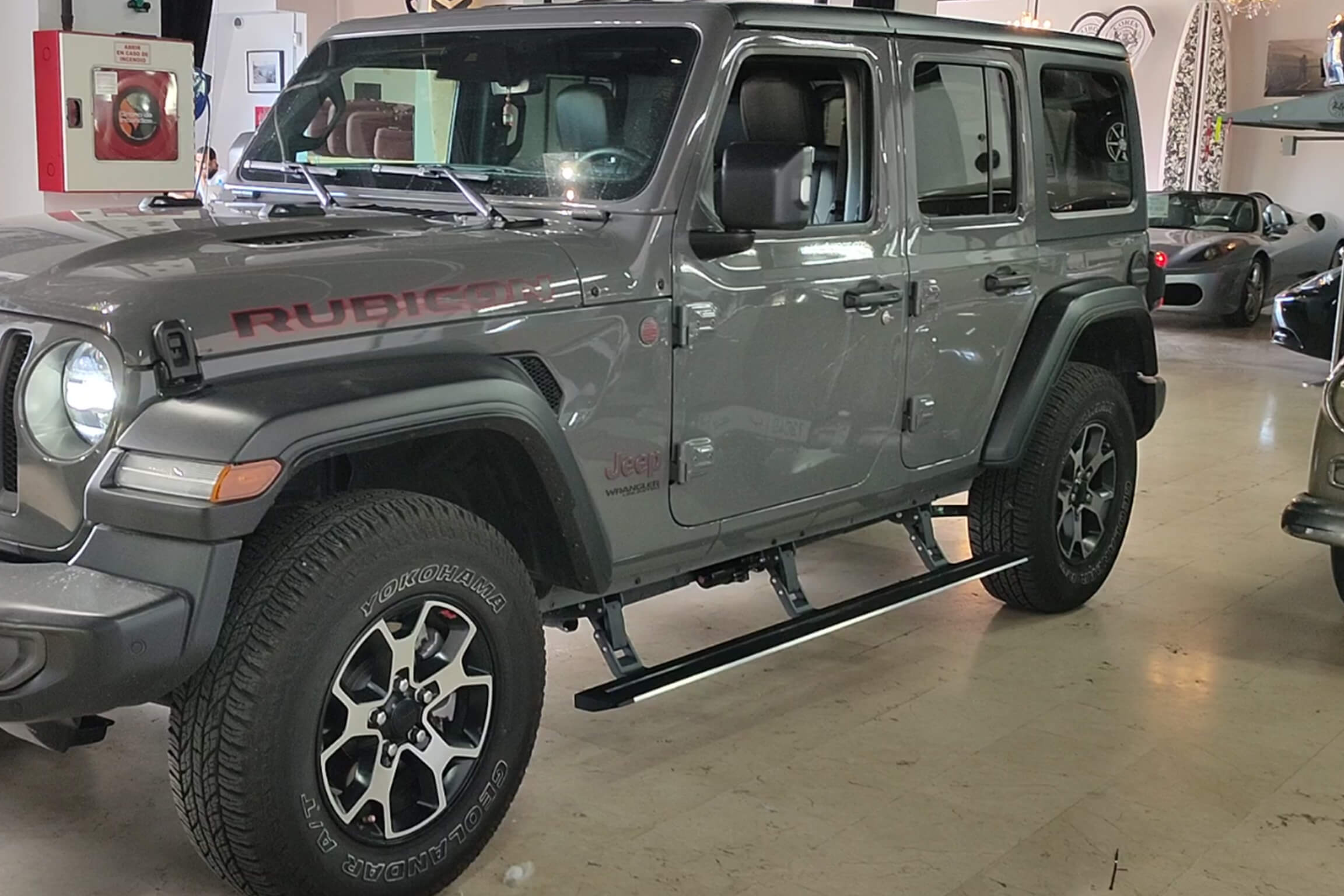 JL Unlimited Series Electric Folding Side Steps - Cohen & Cars